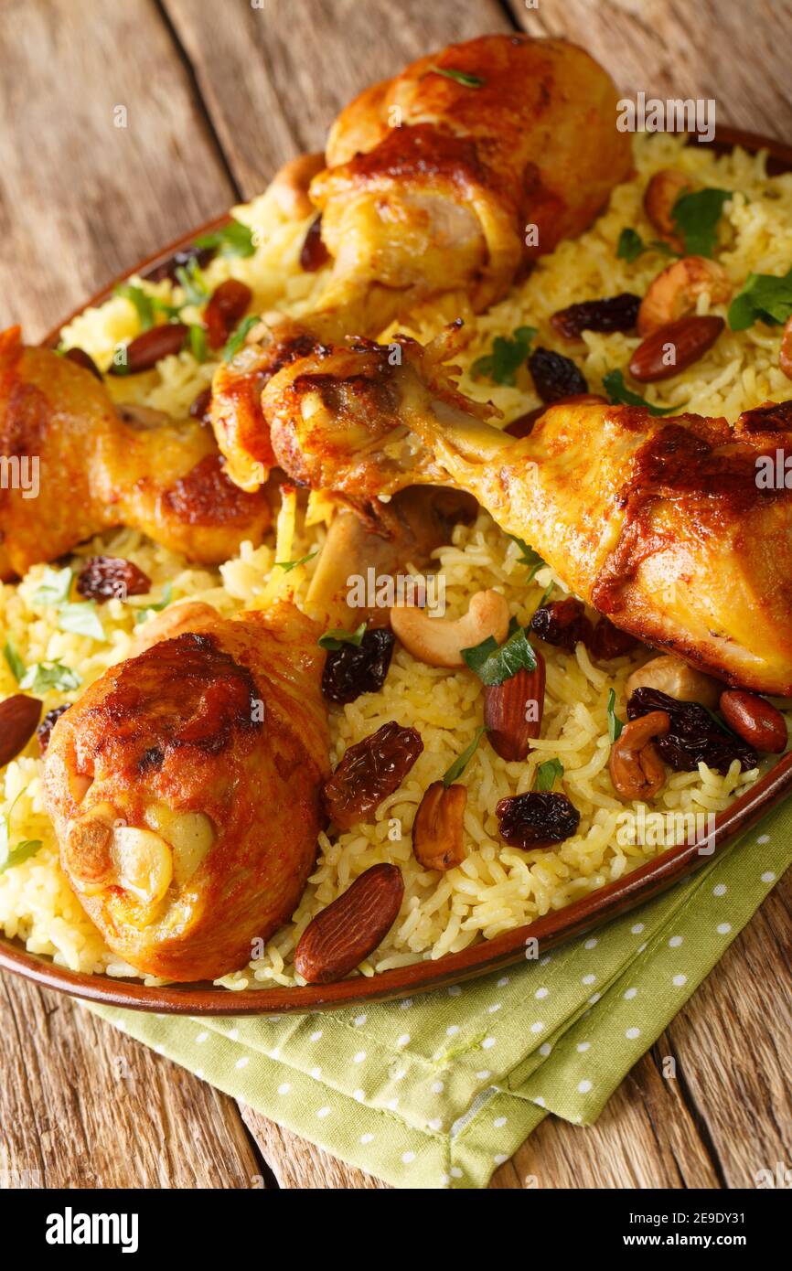 Chicken majboos is a traditional spiced Arab rice dish closeup in the ...