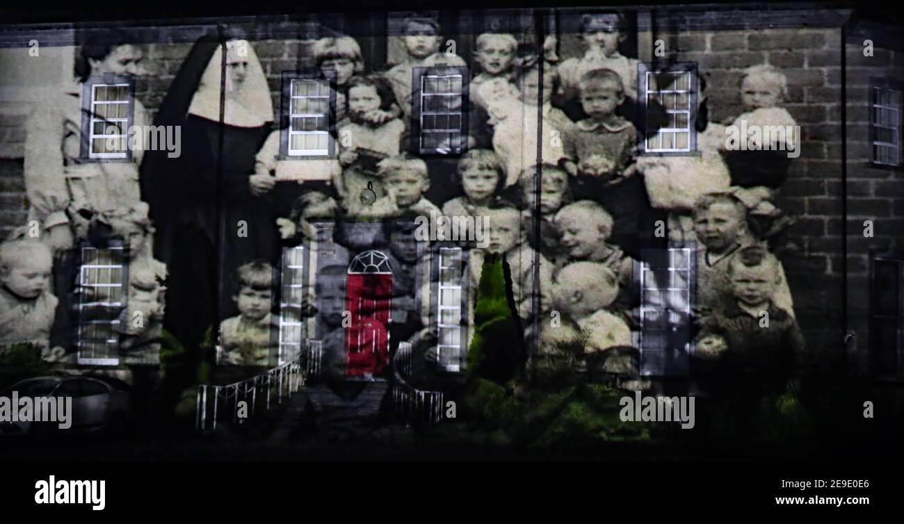 A picture of Mother and baby homes are projected onto Sean Ross Abbey ...
