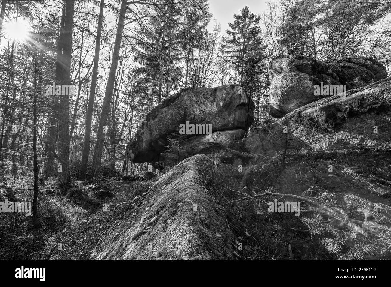 Ancient weathered megalithic granite rock formation with cave and ...