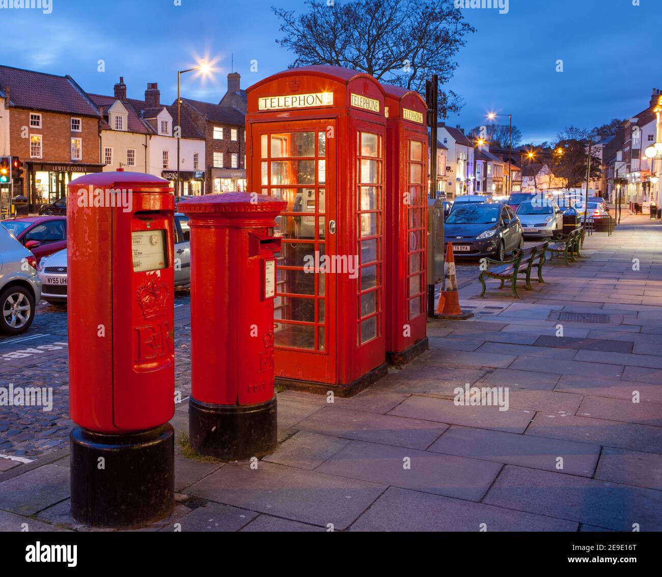 Evening view of the red phone boxes and post boxes on Yarm High Street ...