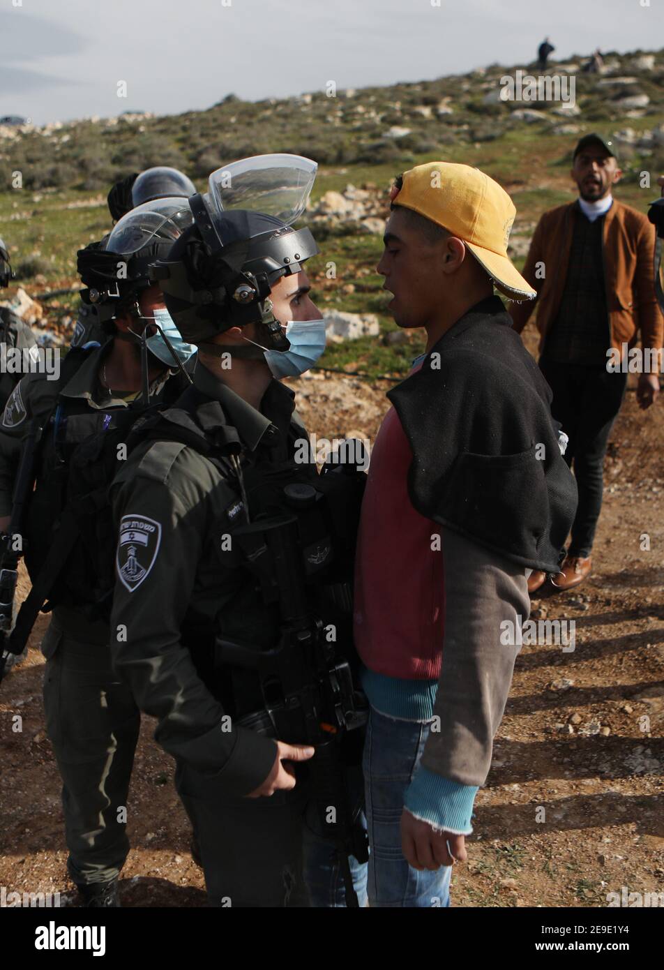 Hebron. 4th Feb, 2021. A Palestinian young man clashes with members of ...