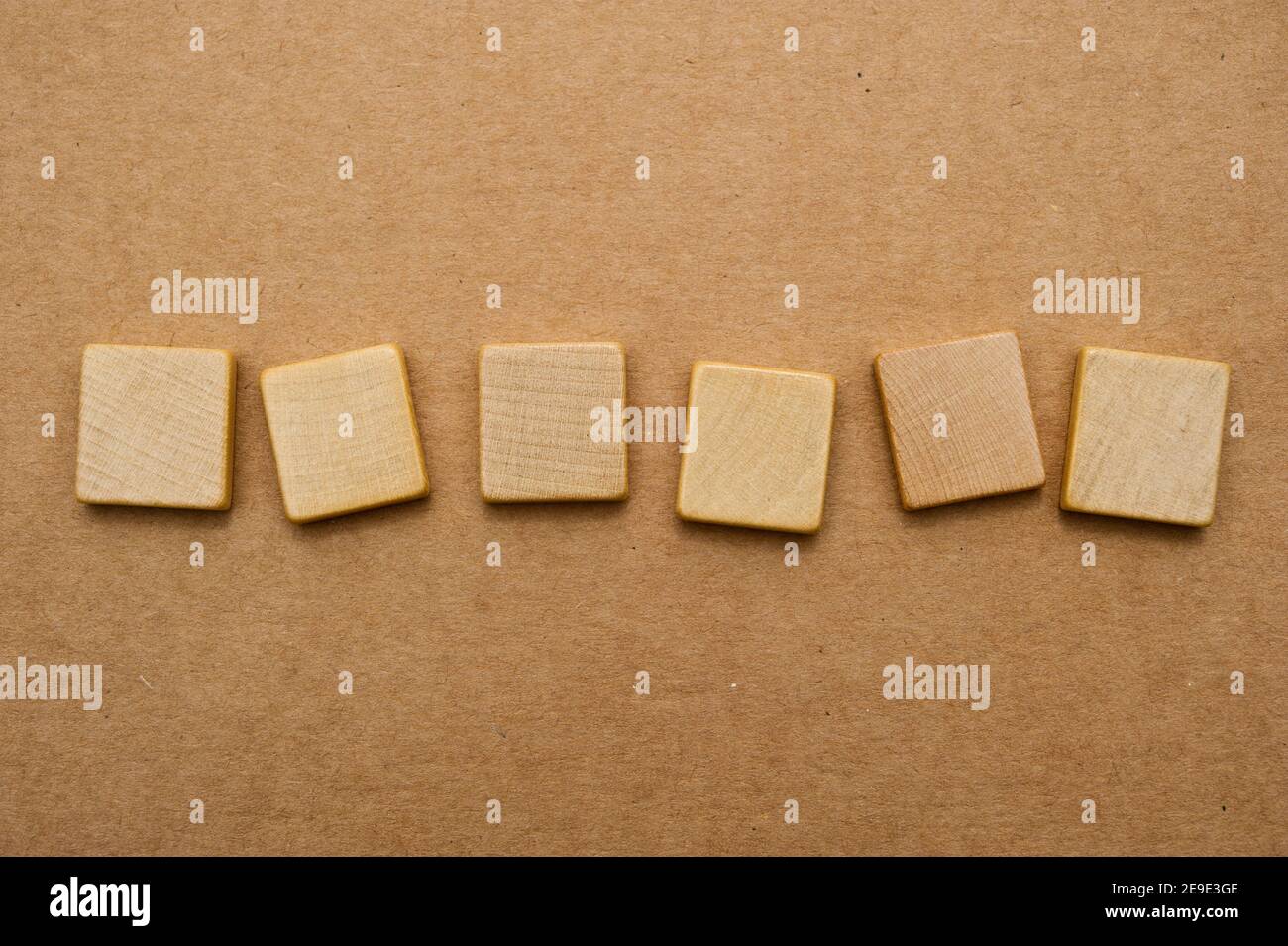 six blank Scrabble tiles Stock Photo - Alamy