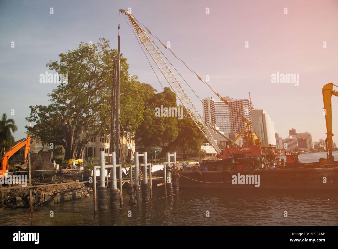 Excavator working at construction site. Backhoe digs ground for the ...