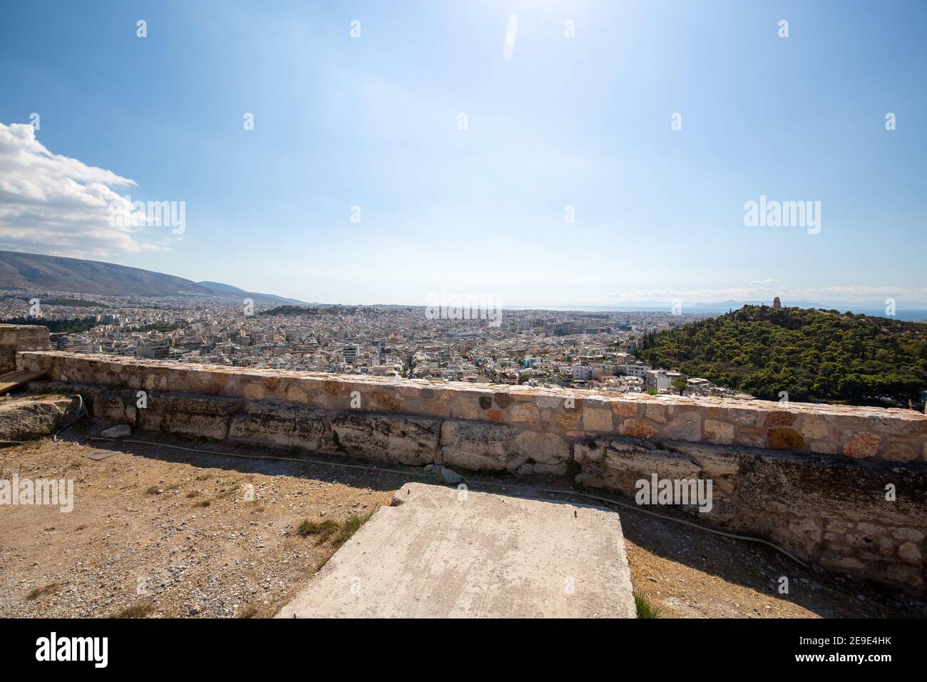 High angle shot of a wonderful city with many brown buildings and green ...