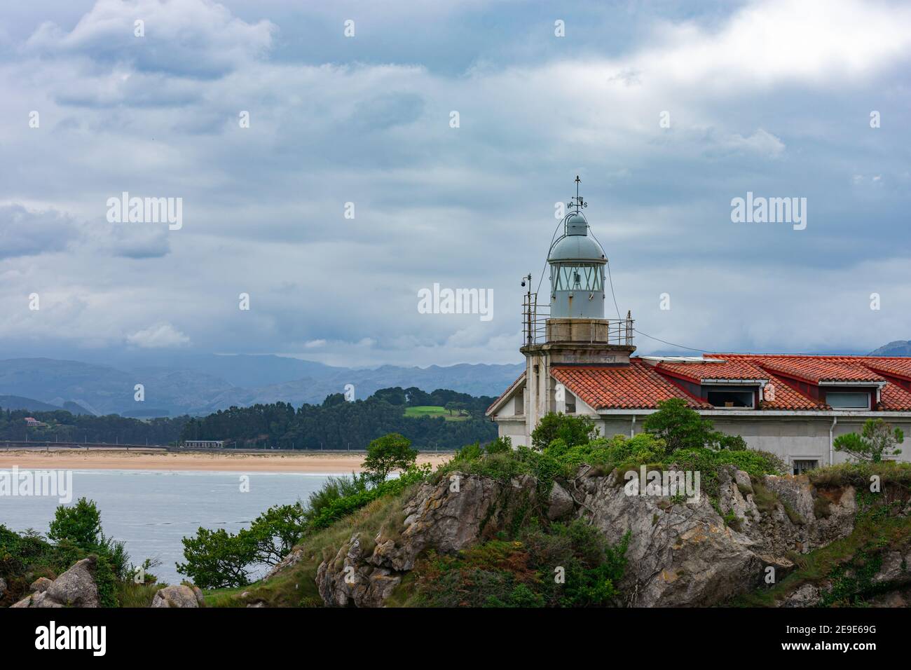 Beautiful scenery of the sea with the view of the rooftop house and ...
