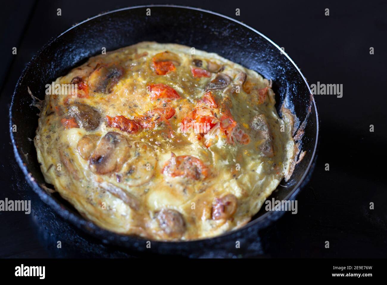 Spanish omelette in a small frying pan Stock Photo - Alamy