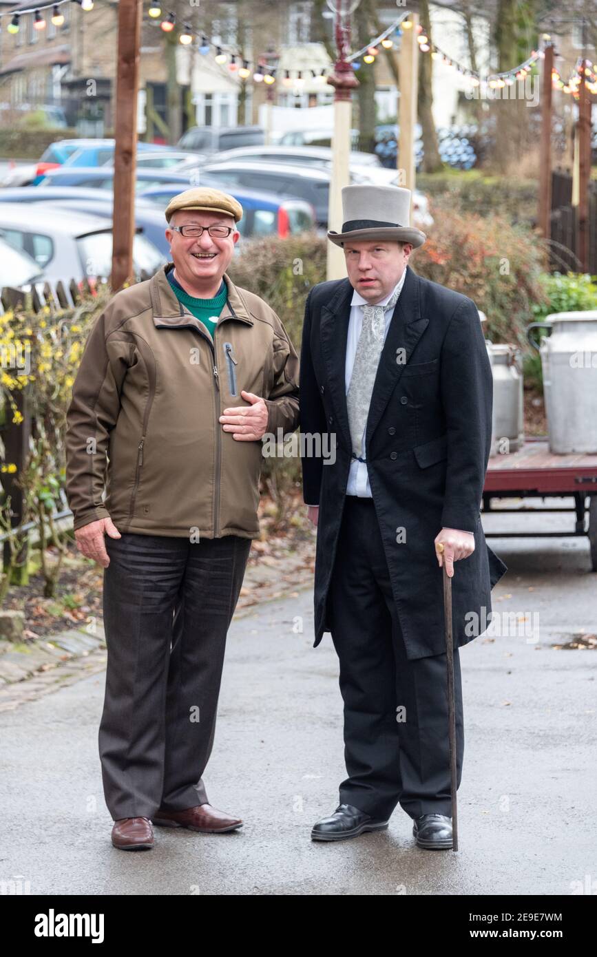 A jolly man standing next to Scrooge Stock Photo - Alamy