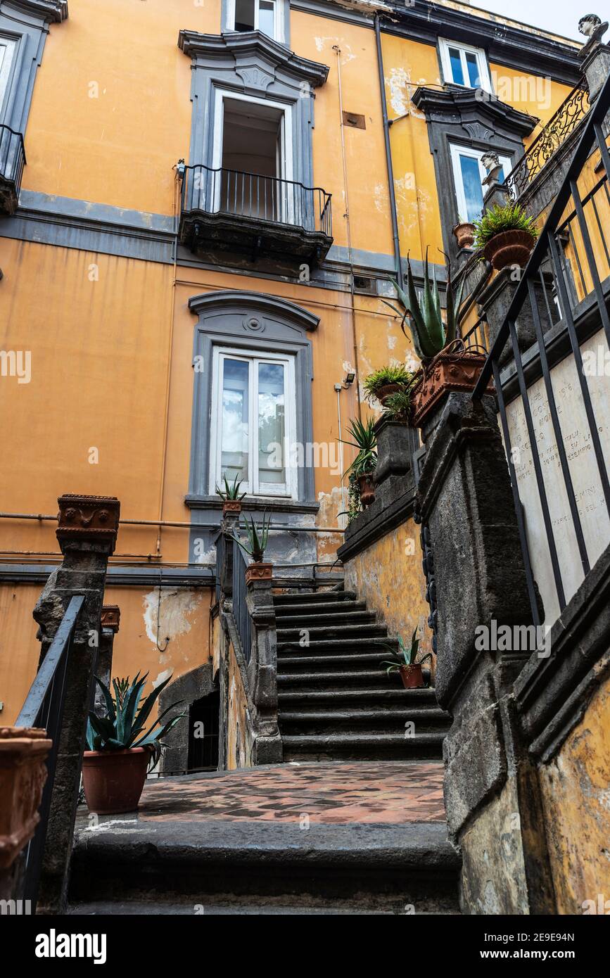 Facade of a classic building or mansion with two stairs and decorated ...