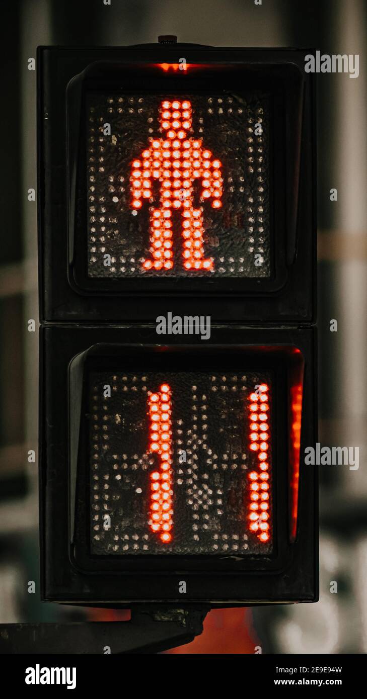A pedestrian traffic red light sign with countdown timer in an urban ...