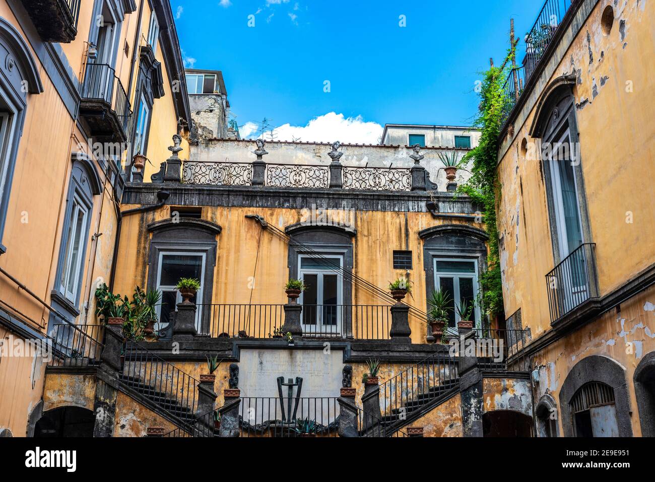 Facade of a classic building or mansion with two stairs and decorated ...