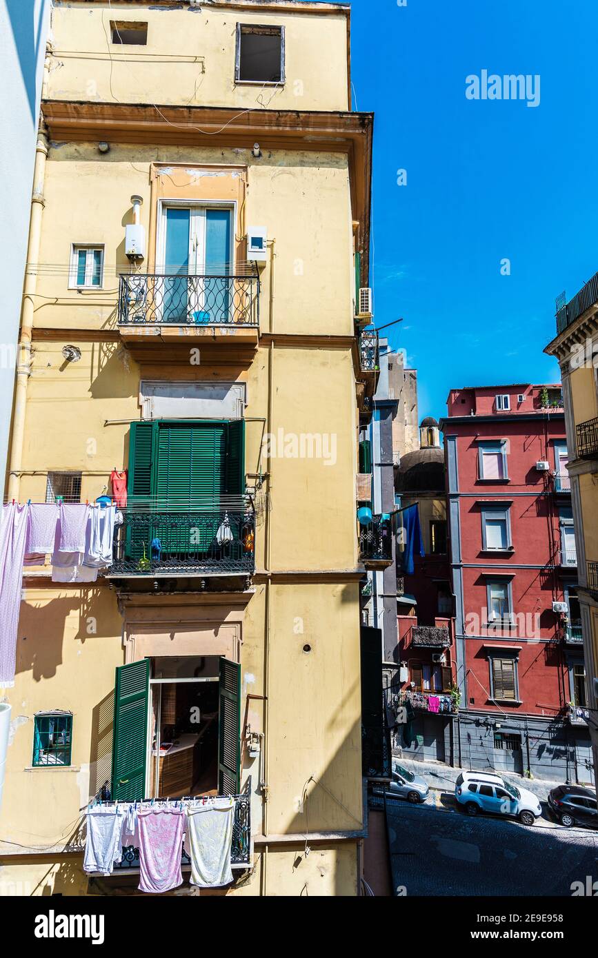 Facade of classic buildings with hanging clothes in the historical ...