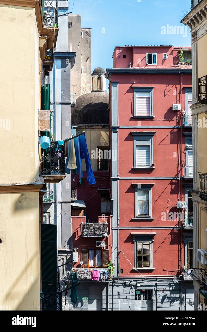 Facade of classic buildings with hanging clothes in the historical ...