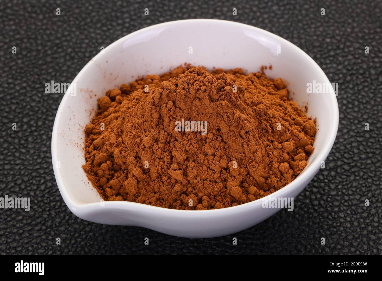 Cocoa powder in the bowl - ready for cooking Stock Photo - Alamy