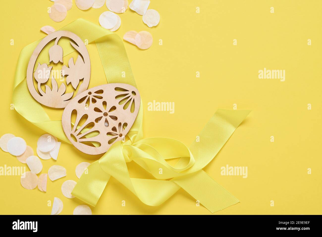 Easter light blue eggs in nest on yellow trend color background. Easter ...