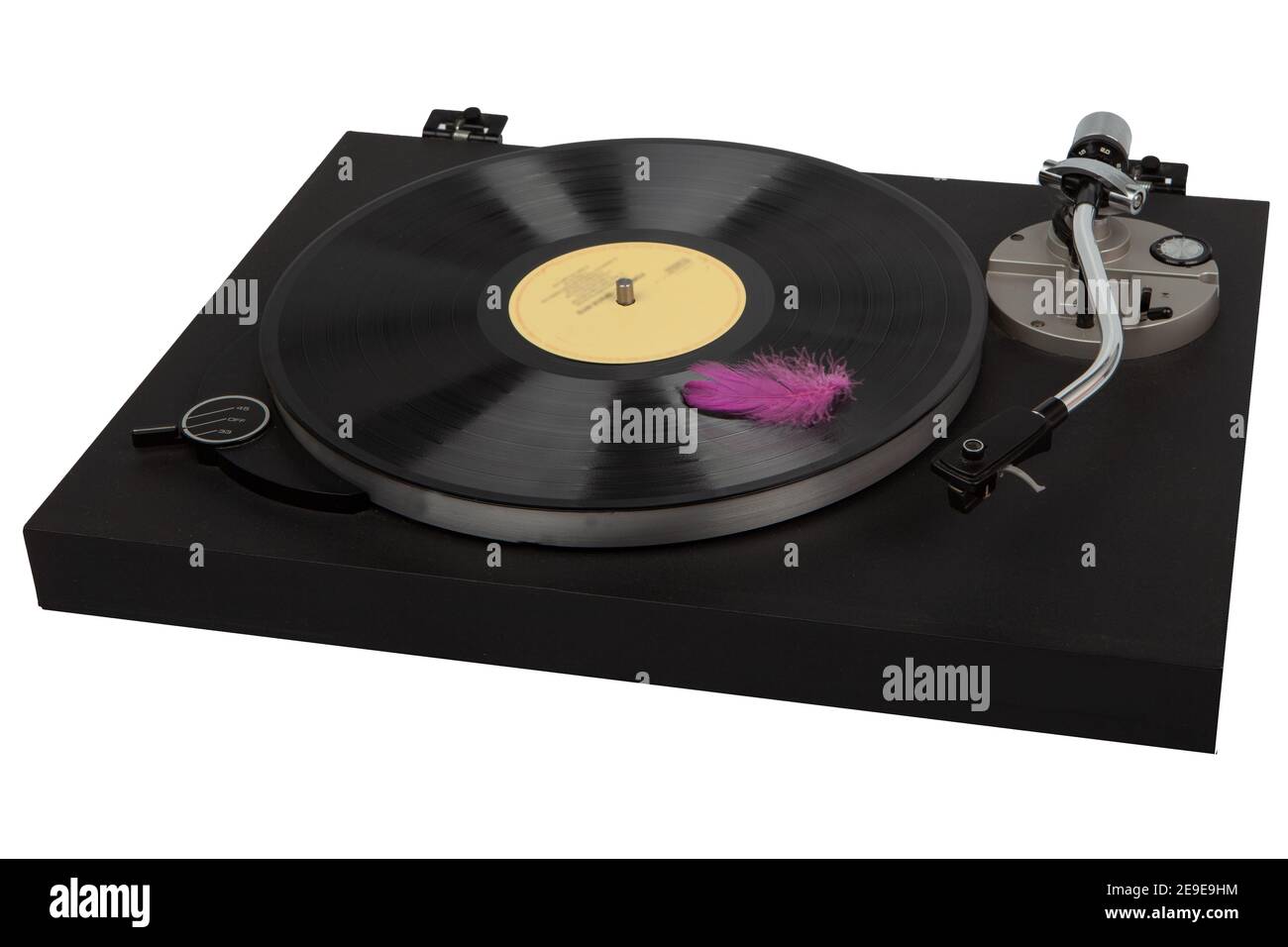 Purple feather on a modern gramophone isolated on a white background ...