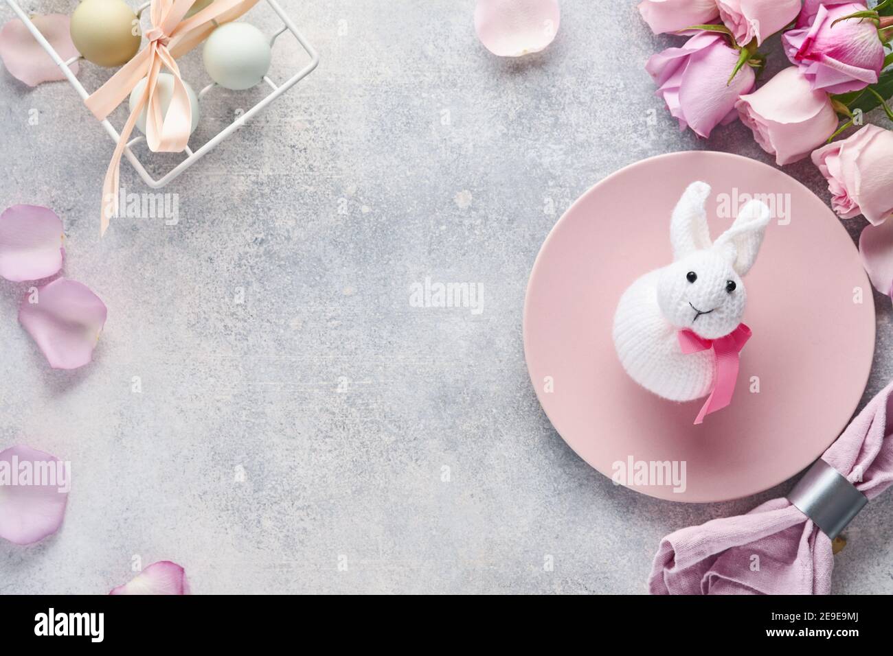 Easter table setting with floral decor on grey table. Elegance dinner ...