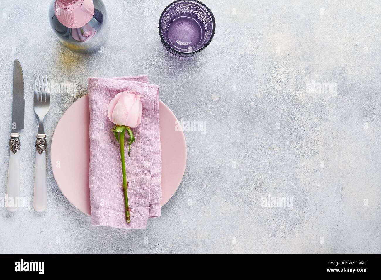 Easter table setting with floral decor on grey table. Elegance dinner ...