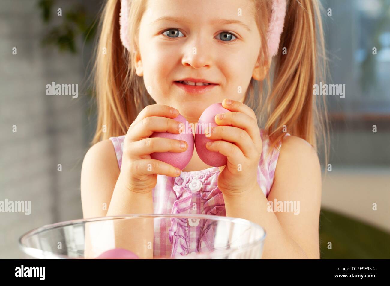 Happy little girl with bunny ears getting ready for Easter party Stock ...