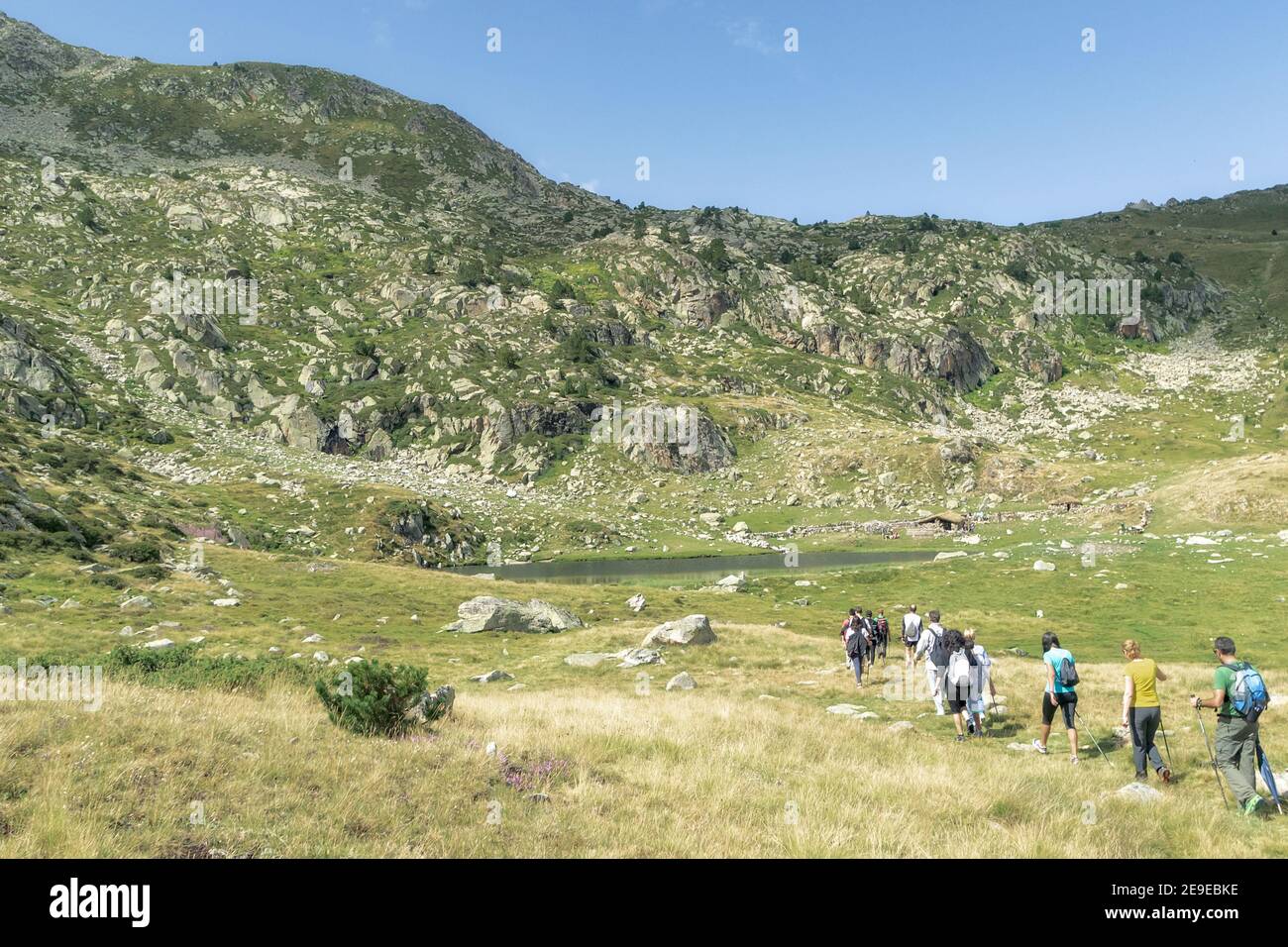 Selective focus - Group of people hiking in the Pyrenees mountains ...