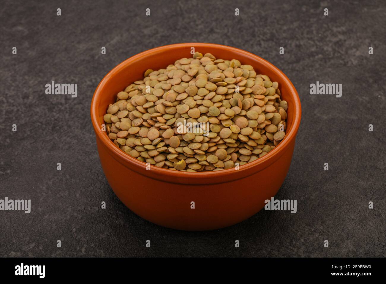 Vegan cuisine - Dry lentil heap isolated Stock Photo - Alamy