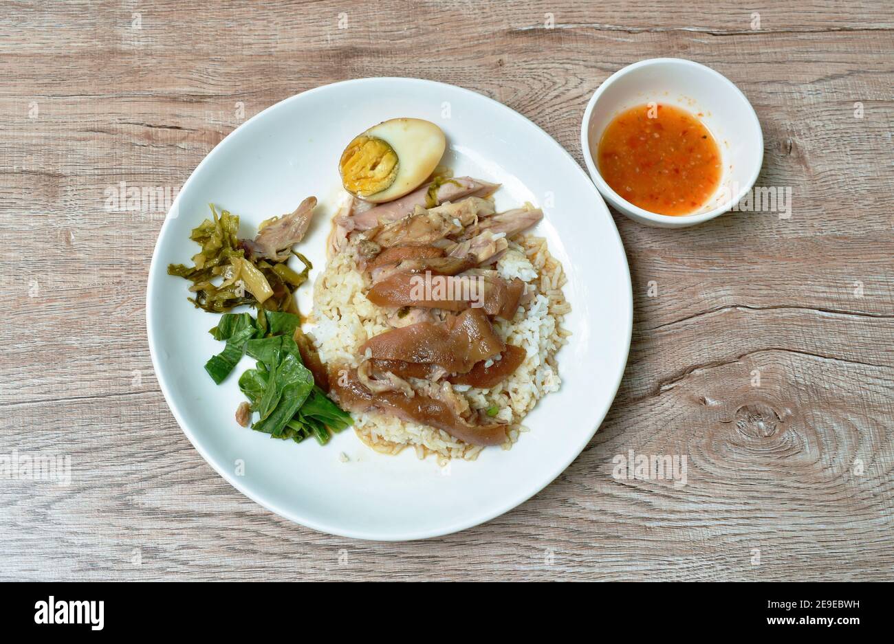 boiled pork leg slice in black Chinese herb soup with egg dipping spicy ...