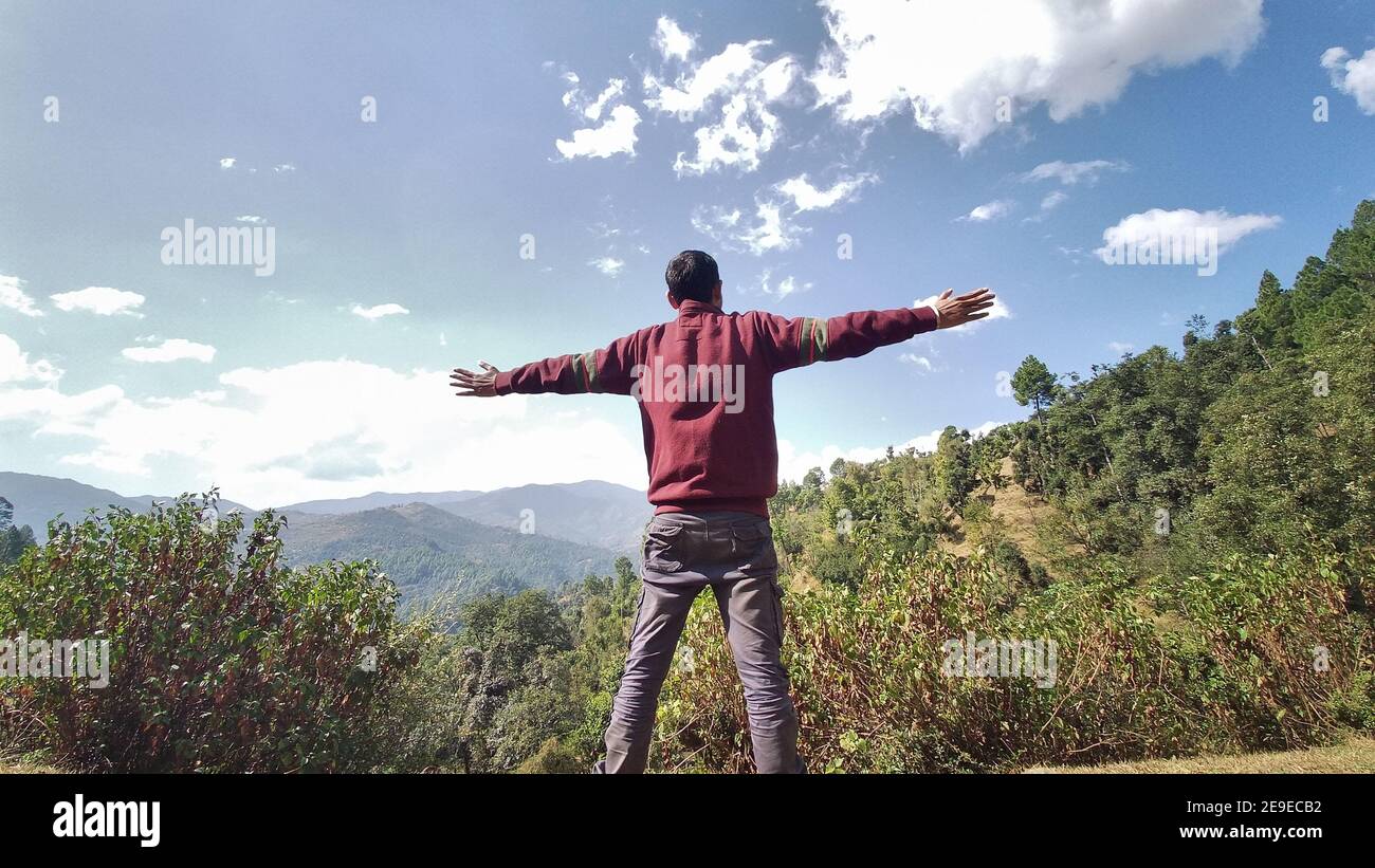 Male with open arms standing outdoors Stock Photo - Alamy