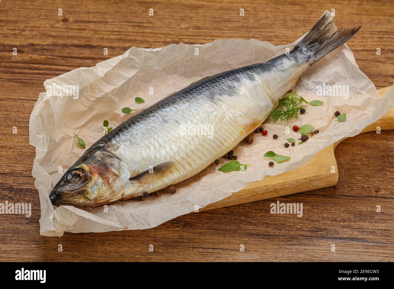 Salted Herring fish with pepper and spices Stock Photo - Alamy