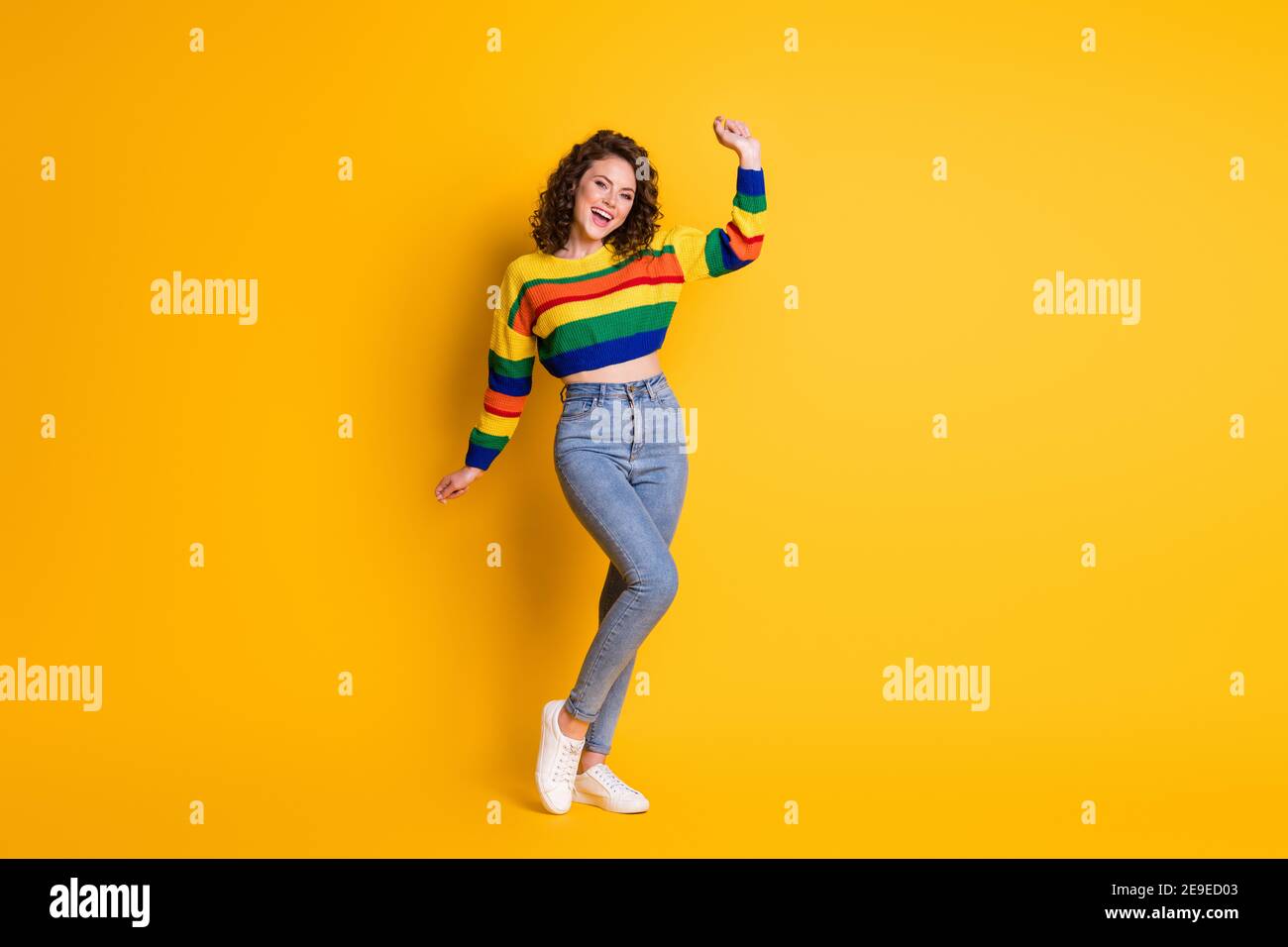 Full length photo of charming girl dance raise arm wear striped cropped ...