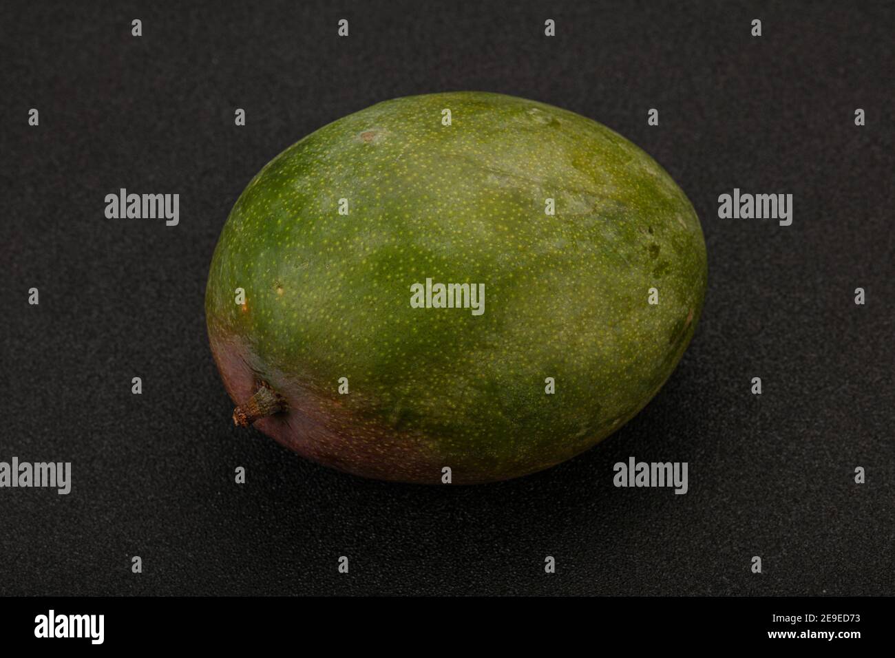 Tropical fruit - Green sweet tasty mango Stock Photo - Alamy