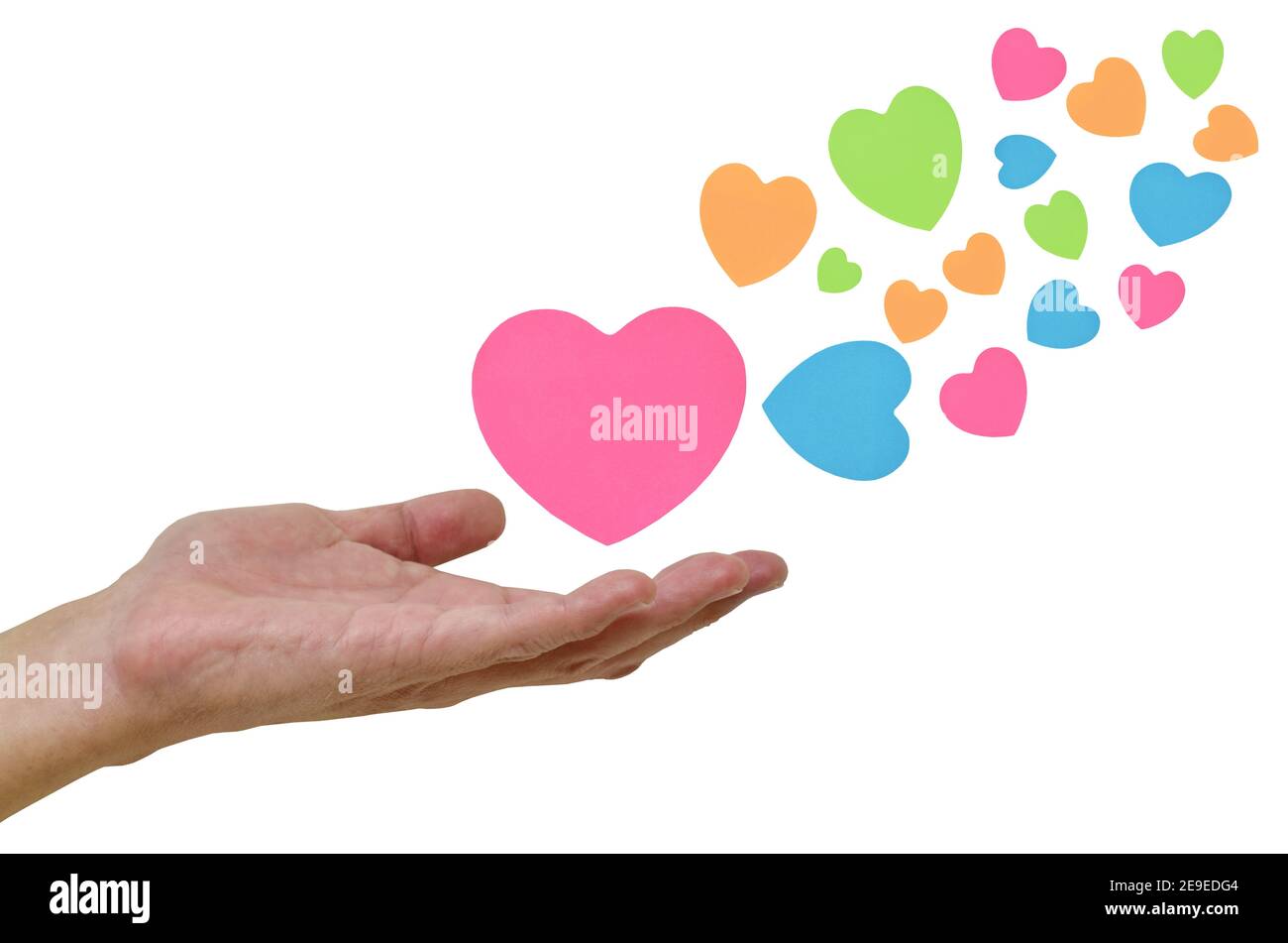 human hand with colorful heart paper note floating with love concepts ...