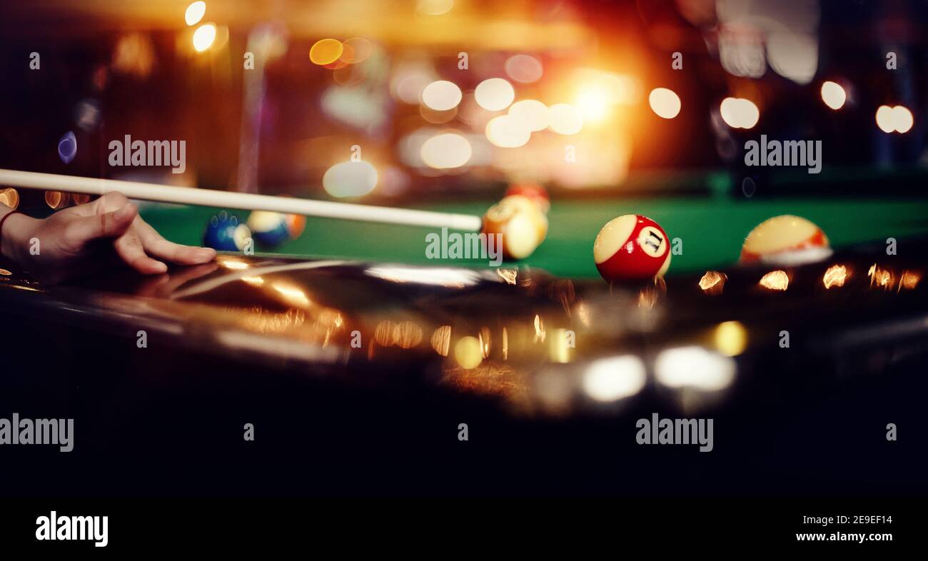 Billiard ball with number eleven on a green billiard table. Gambling ...