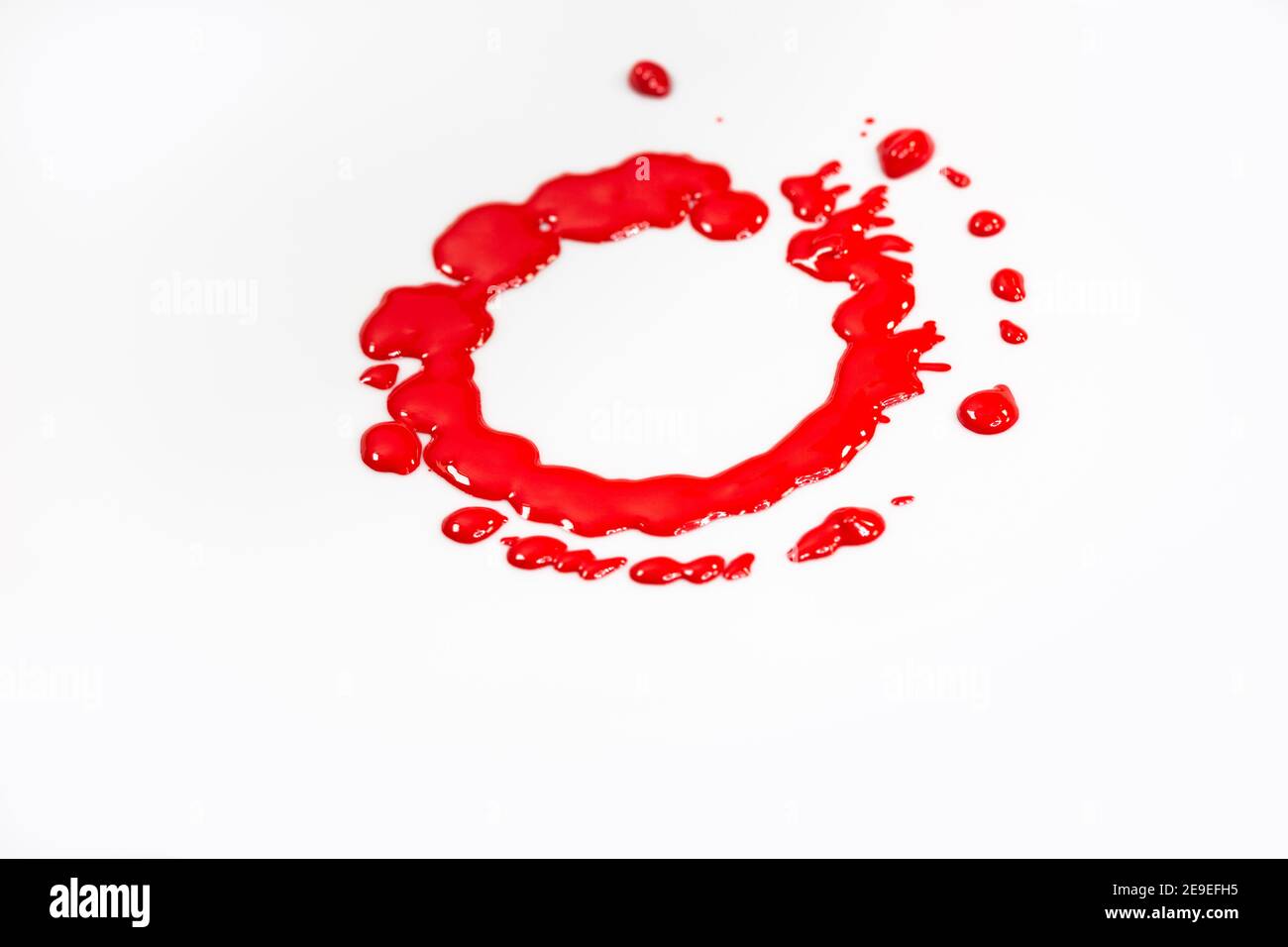 Red ink dripping circles on the ground of a rotating white object Stock ...