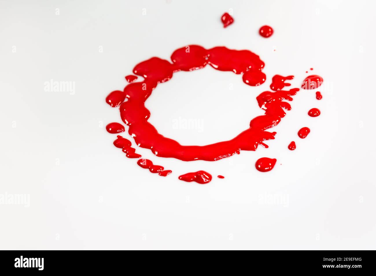 Red ink dripping circles on the ground of a rotating white object Stock ...