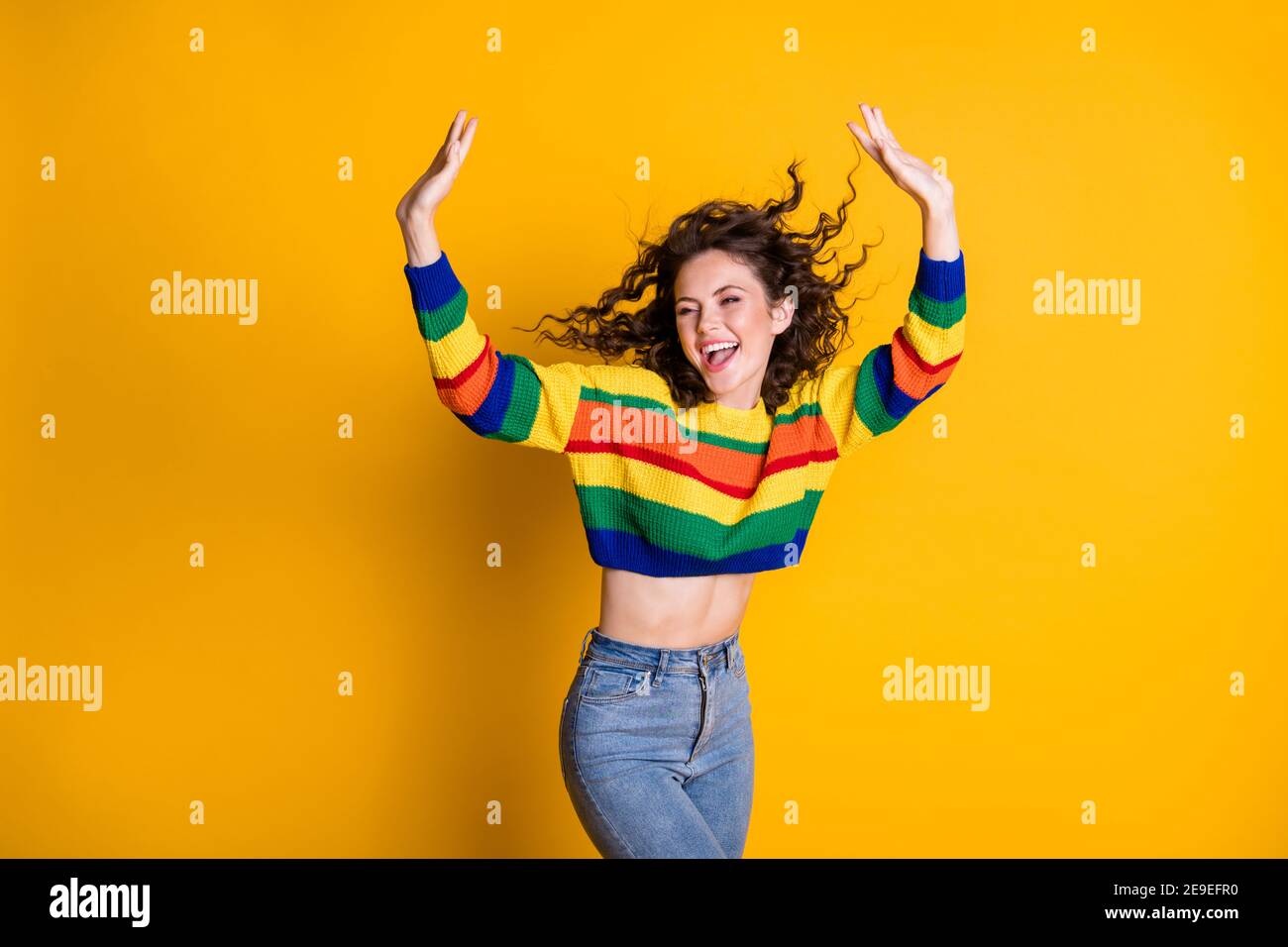 Photo of adorable sweet lady wearing casual colorful sweater dancing ...