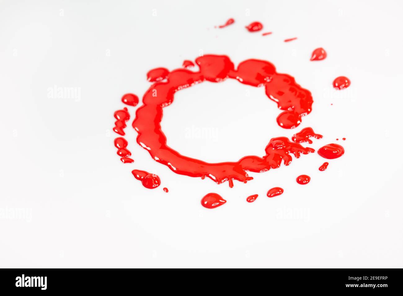 Red ink dripping circles on the ground of a rotating white object Stock ...