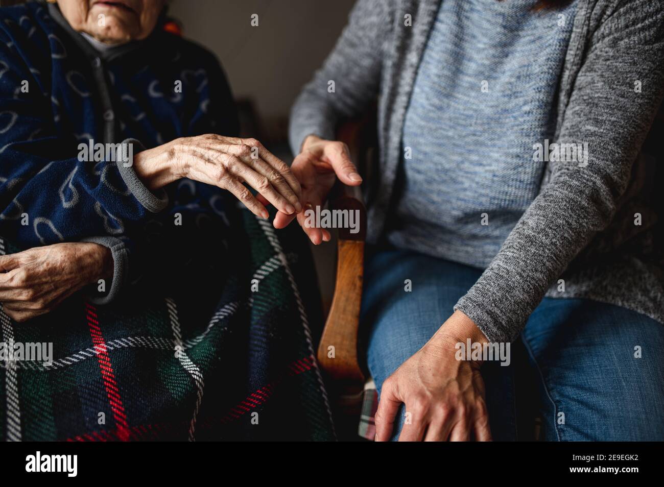 Female holding hand of an old woman - family care concept Stock Photo ...