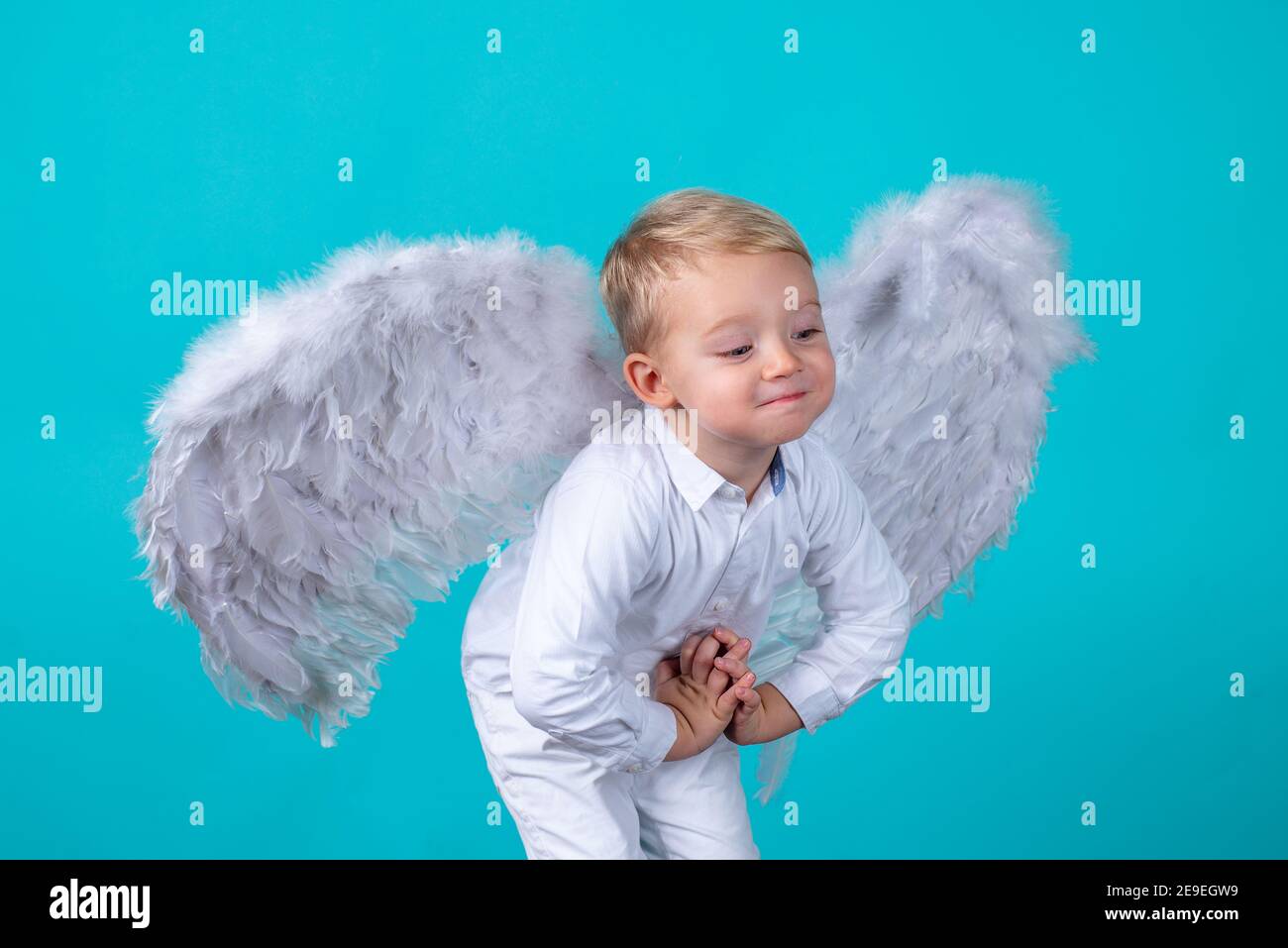 Funny child wearing angel wings with fun smile happy expression Stock ...