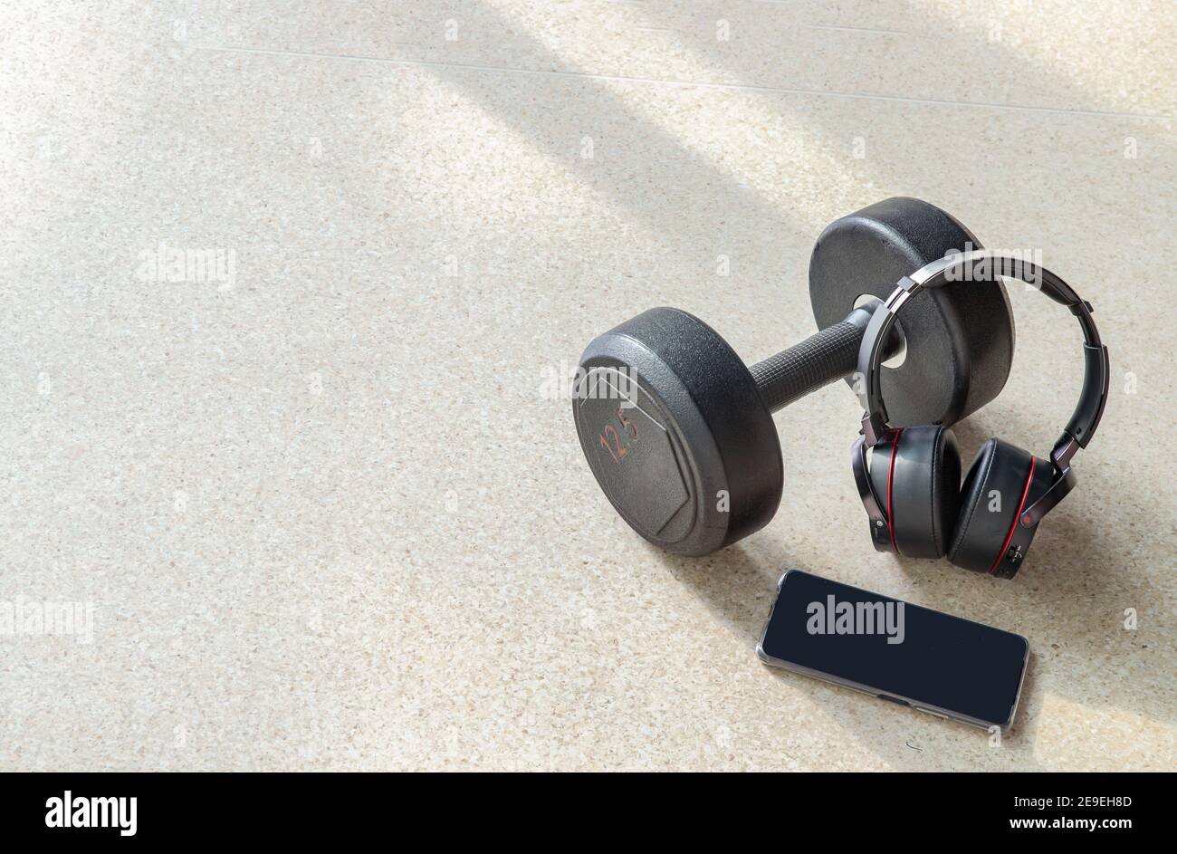 Composition of Smartphone, Headphones and Dumbbell for Listening to ...