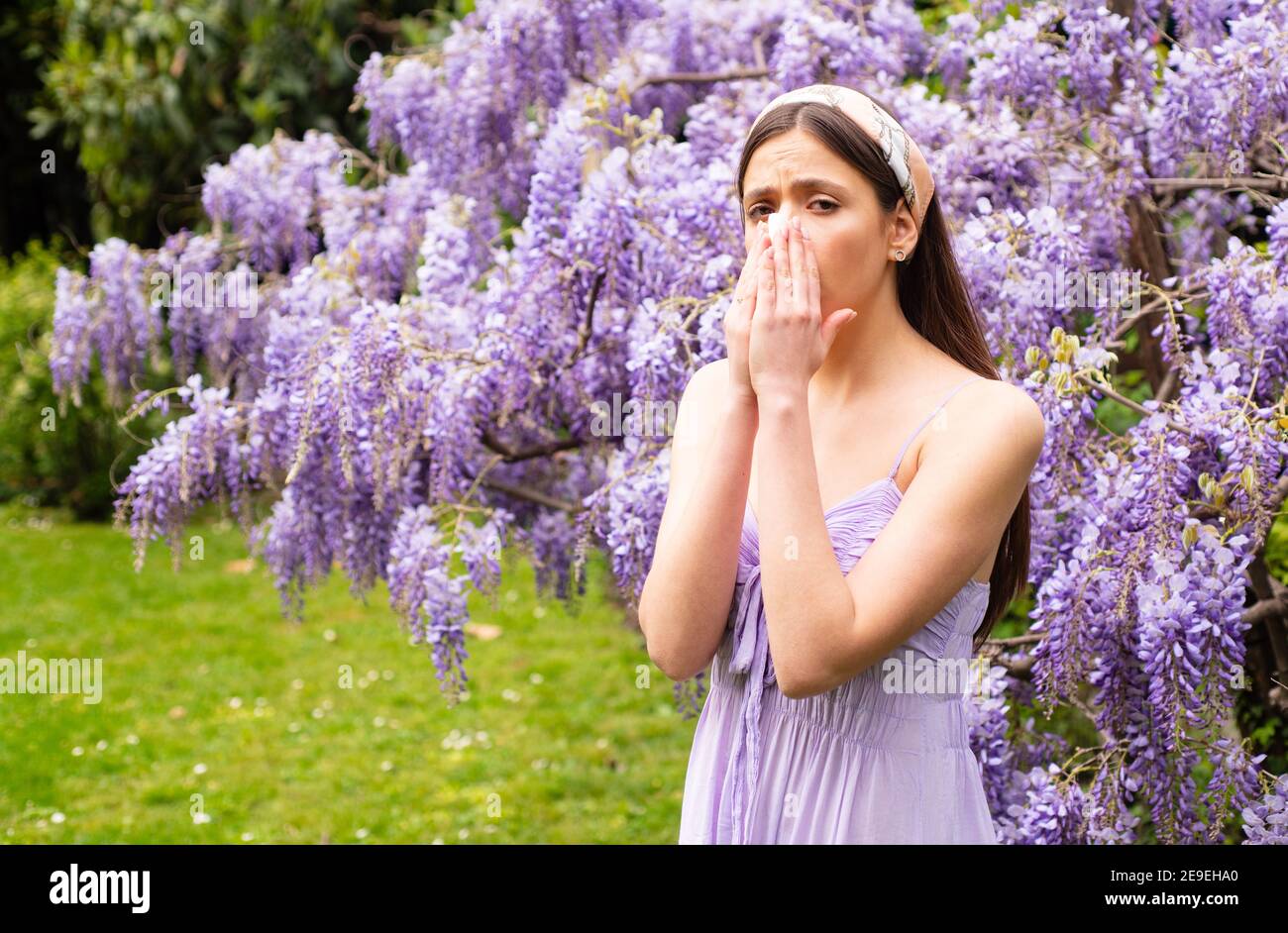 Spring allergy. Girl with nose sneezing. Allergic symptom concept ...