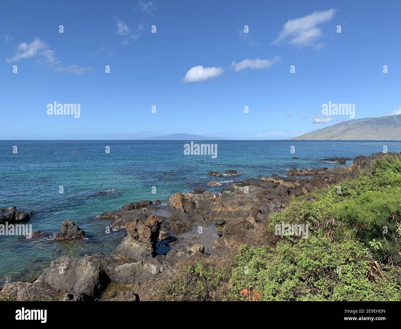 Beautiful shot of pacific ocean view with black volcanic rock beach on ...