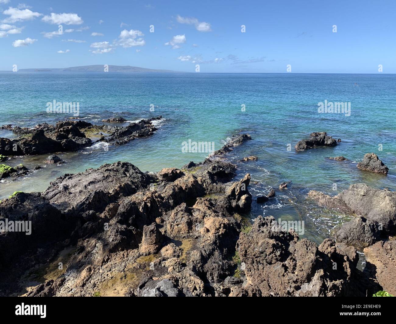 Beautiful shot of pacific ocean view with black volcanic rock beach on ...