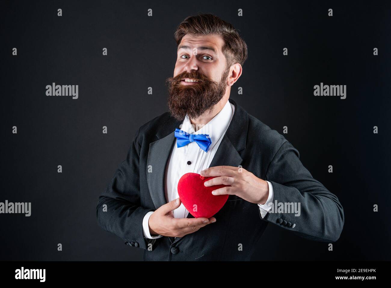Special evening. romantic gift. happy tuxedo man with heart. happy ...