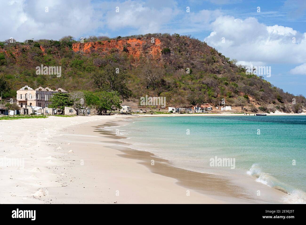 Spectacular sandy orange beach with turquoise water, with ruins of ...