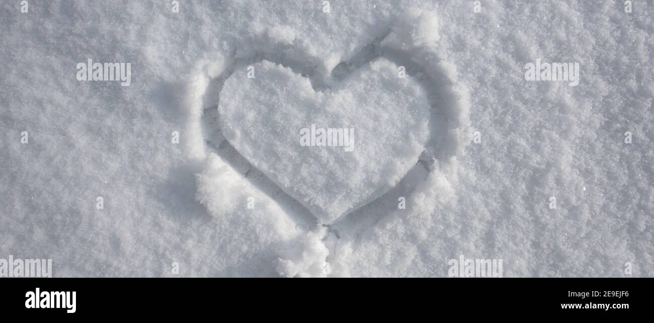 Heart on snow. Wintertime background. White background. Snow texture ...