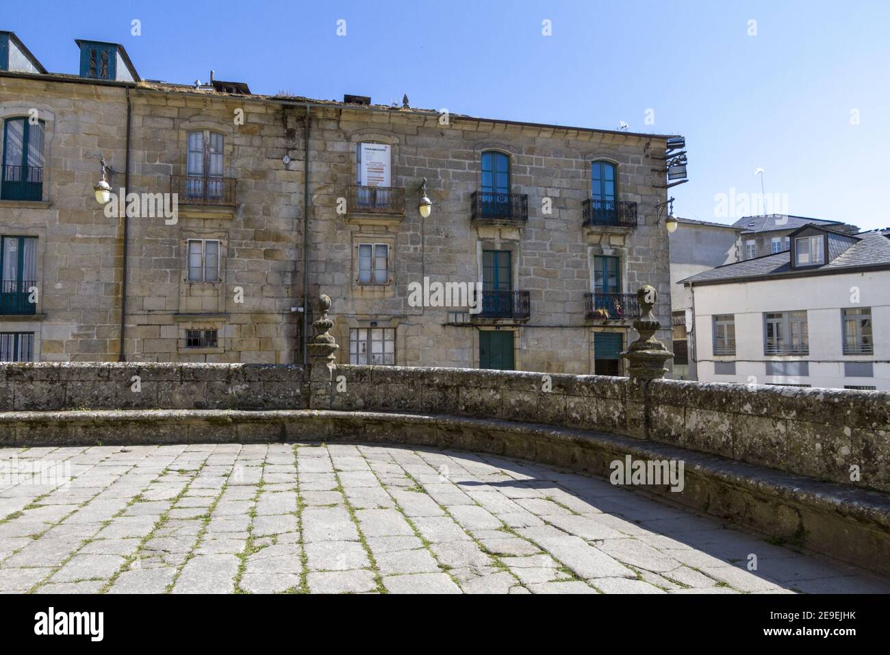 Vintage stone building under a clear blue sky Stock Photo - Alamy