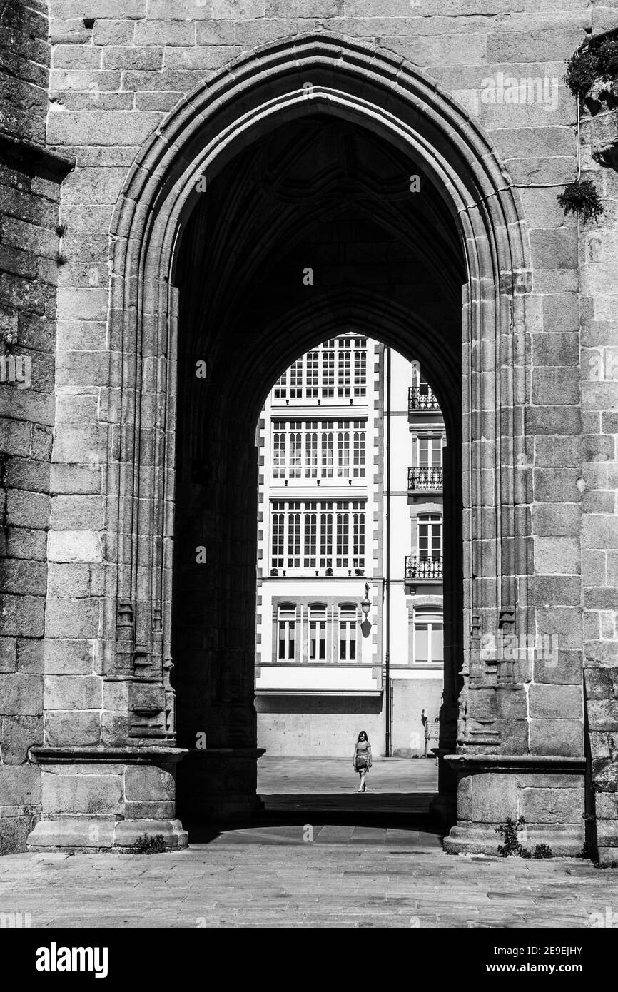 Vertical grayscale shot of a stone gate Stock Photo - Alamy