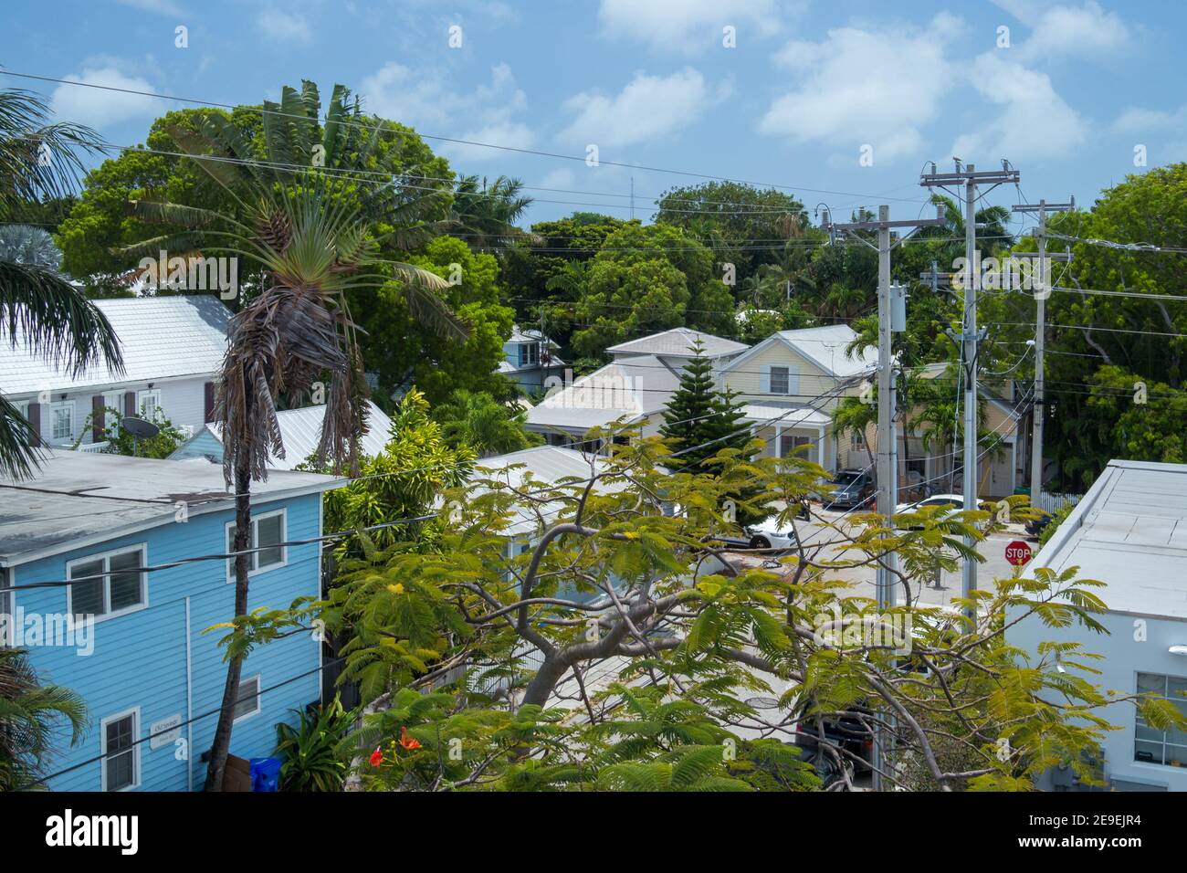 Key West, USA - 04.30.2017: Wooden houses and trees on the streets seen ...