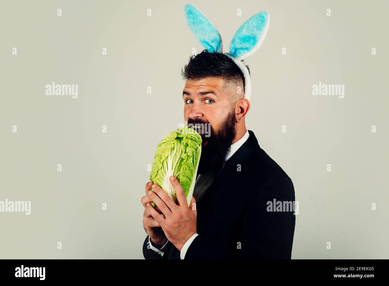 Easter bunny man eat cabbage hare. Healthy male on holiday. Happy ...
