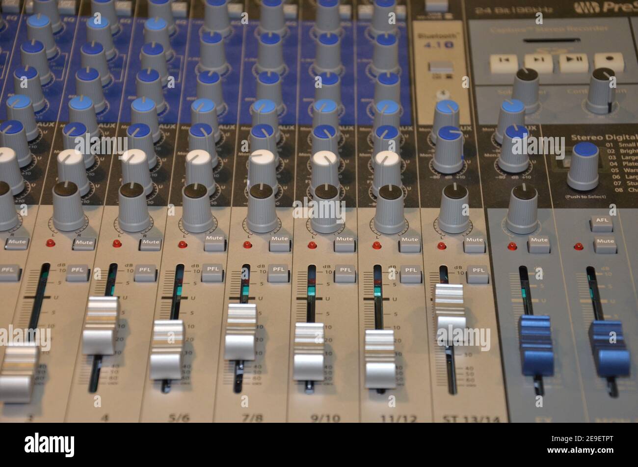 Professional audio mixing console with faders and adjusting knobs Stock ...