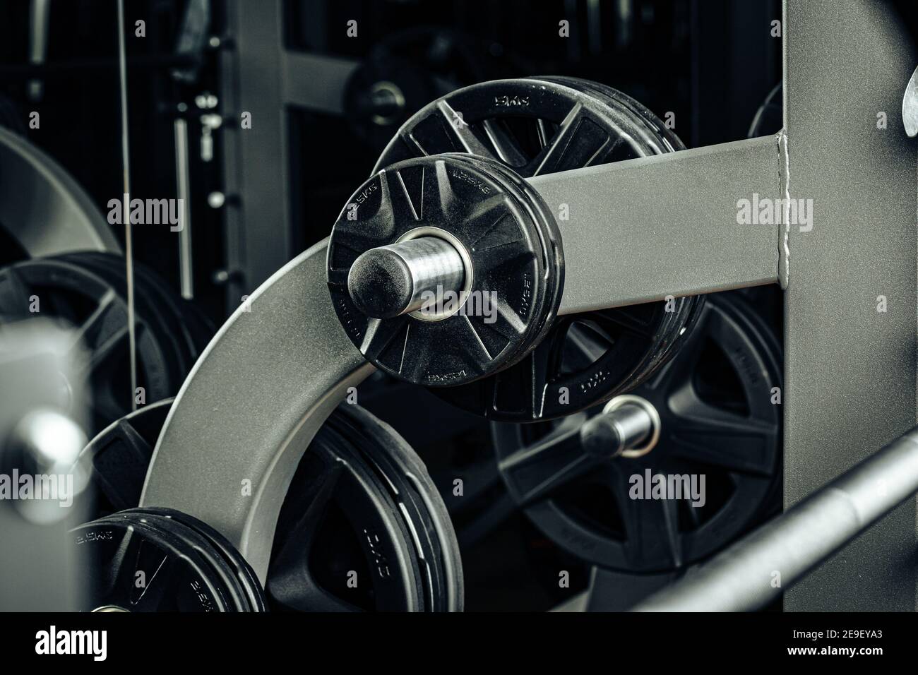 Gym weight plates on holder close up Stock Photo - Alamy